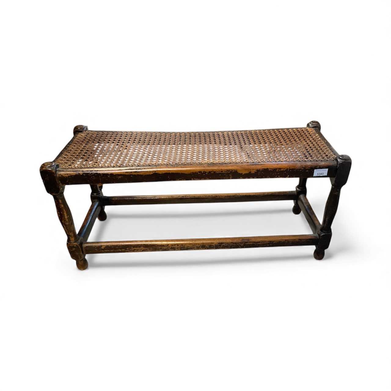 Lot 5343 - 1920s oak long foot stool with caned top on