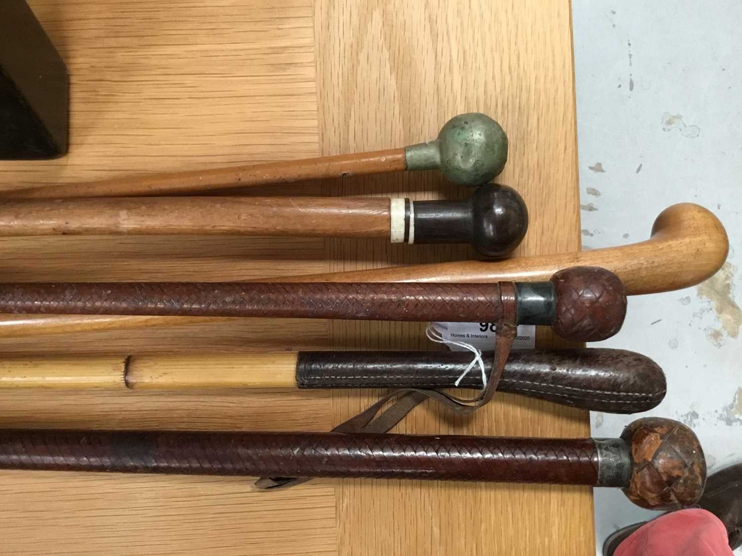 Lot 98 - Silver mounted leather covered cane, similar